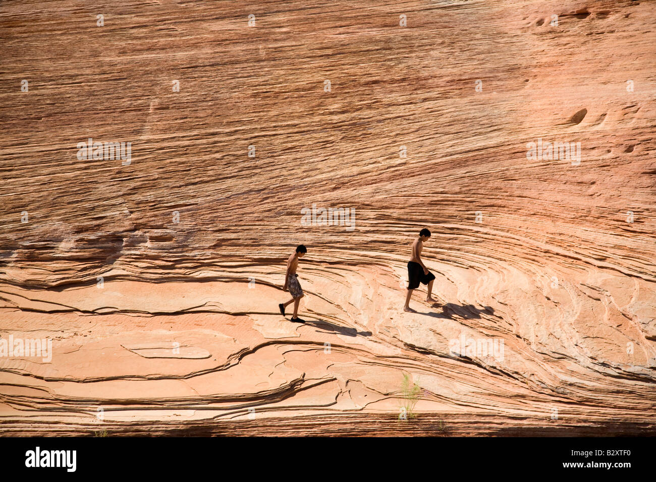 Two boys by the banks of Lake Powell Stock Photo - Alamy
