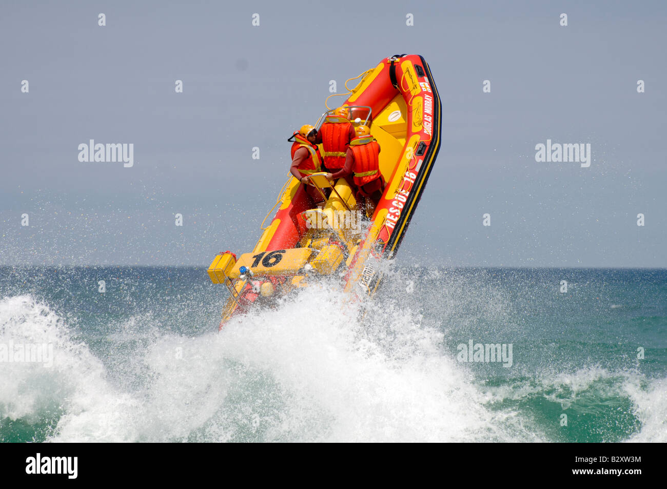 lifeboat from the national sea rescue institute crashing through waves ...