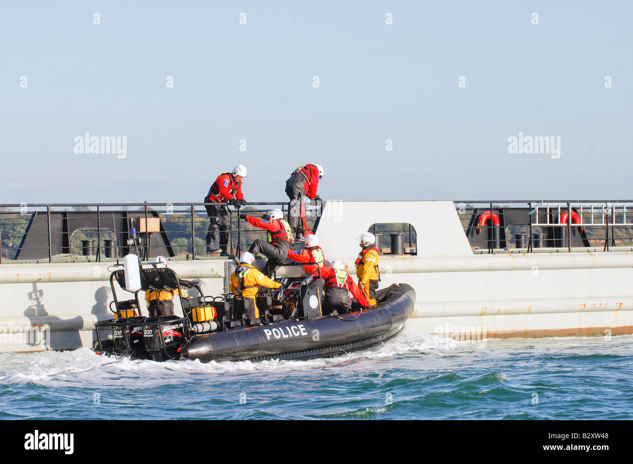 police using a halmatic rib boat to intercept a boat for investigation ...