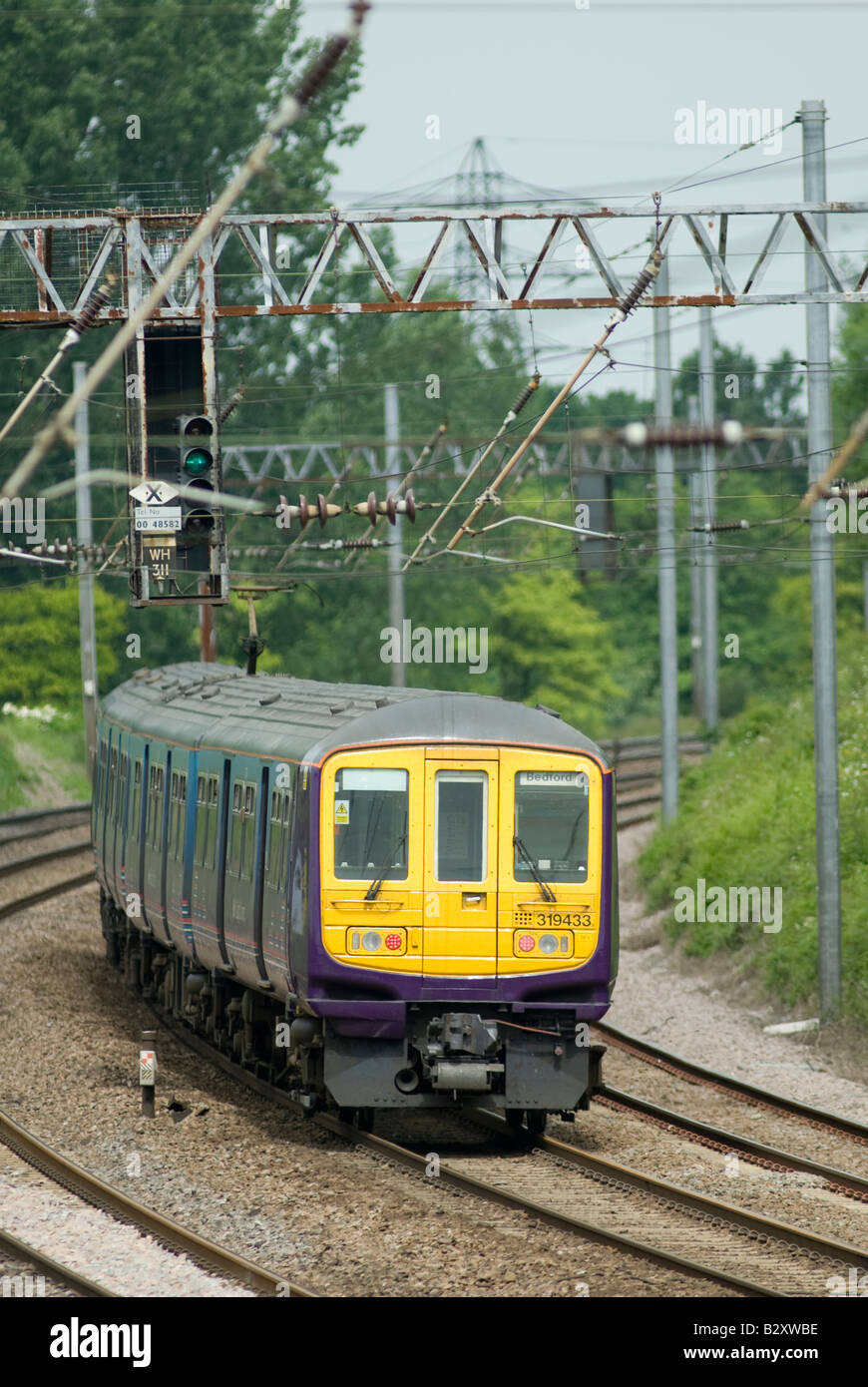 class 319 train in first capital connect livery travelling beneath ...