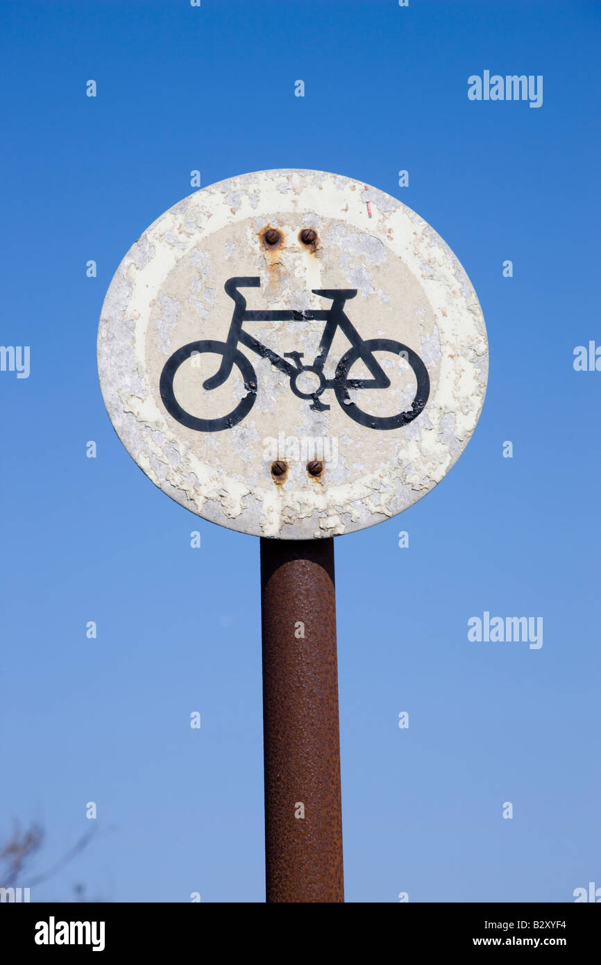 Old and faded cycling prohibited sign Stock Photo - Alamy