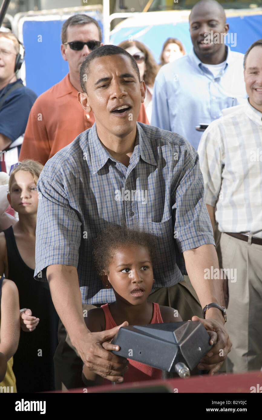 U.S. Senator Barak Obama campaigning for President with his daughter at ...