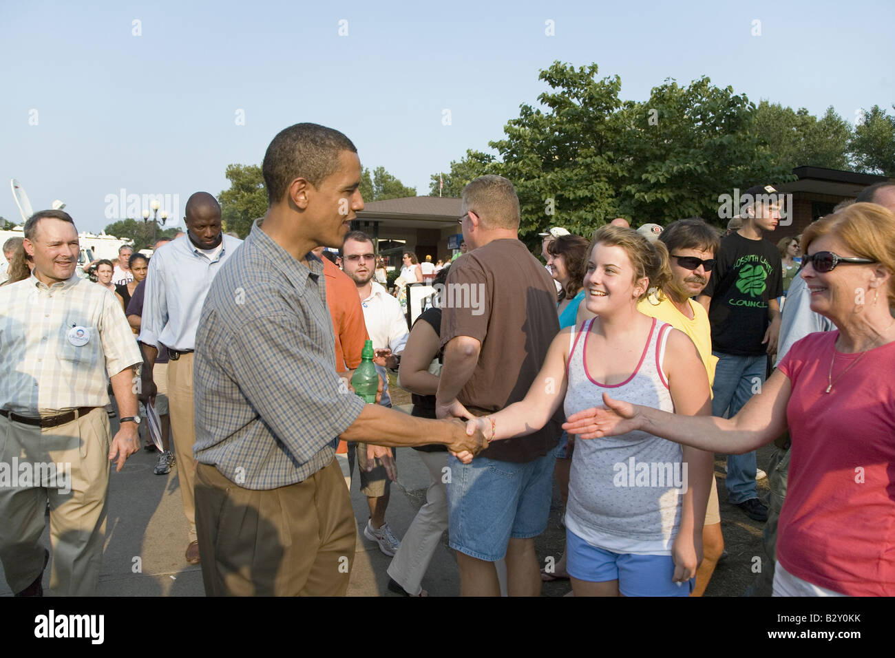 U.S. Senator Barak Obama shaking hands while campaigning for President ...