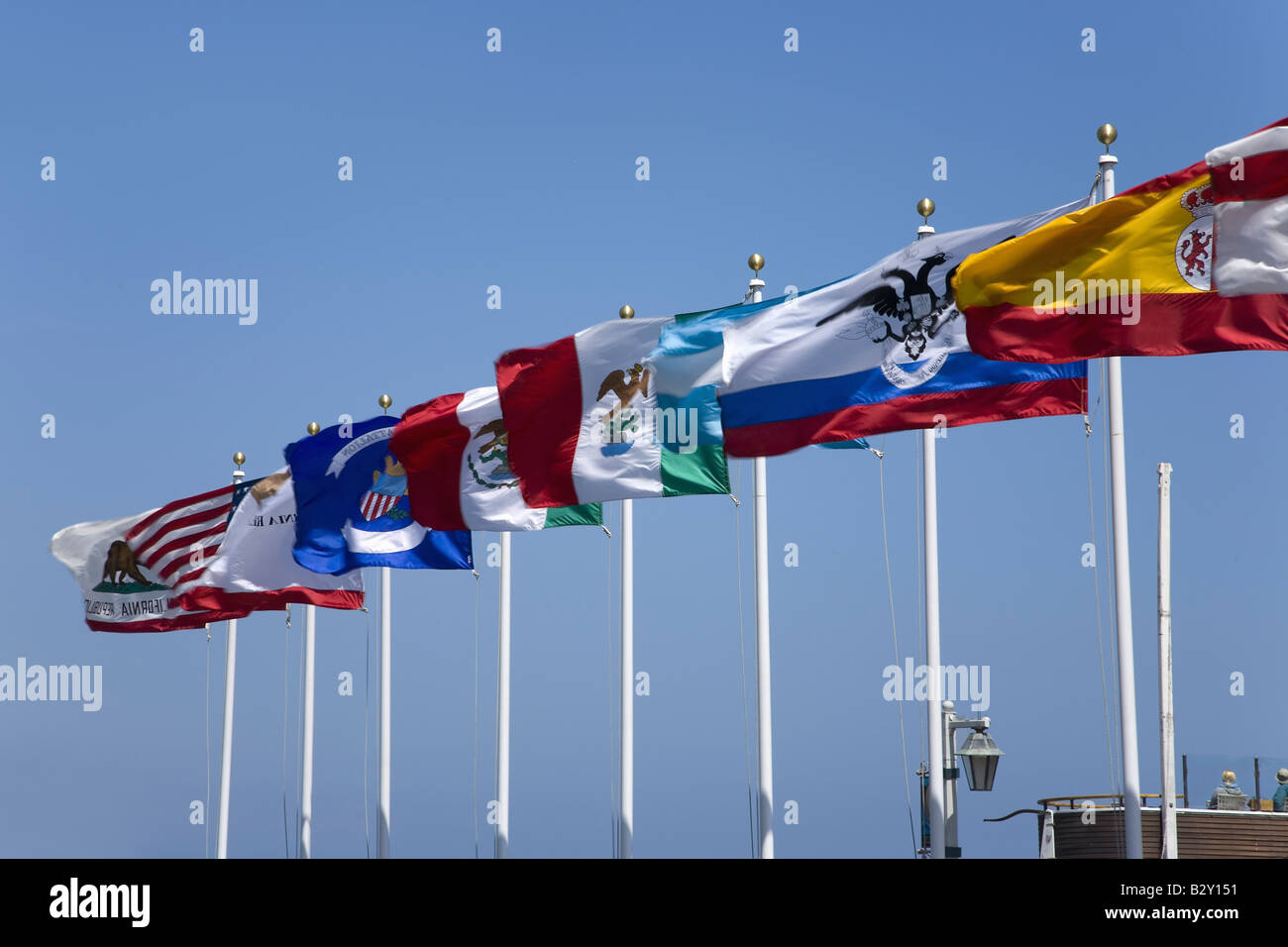 Multi-colored flags flying from pier in Santa Barbara, California Stock ...