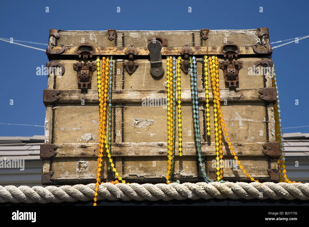 Treasure chest with fake necklaces hanging from trunk on pier of Santa ...