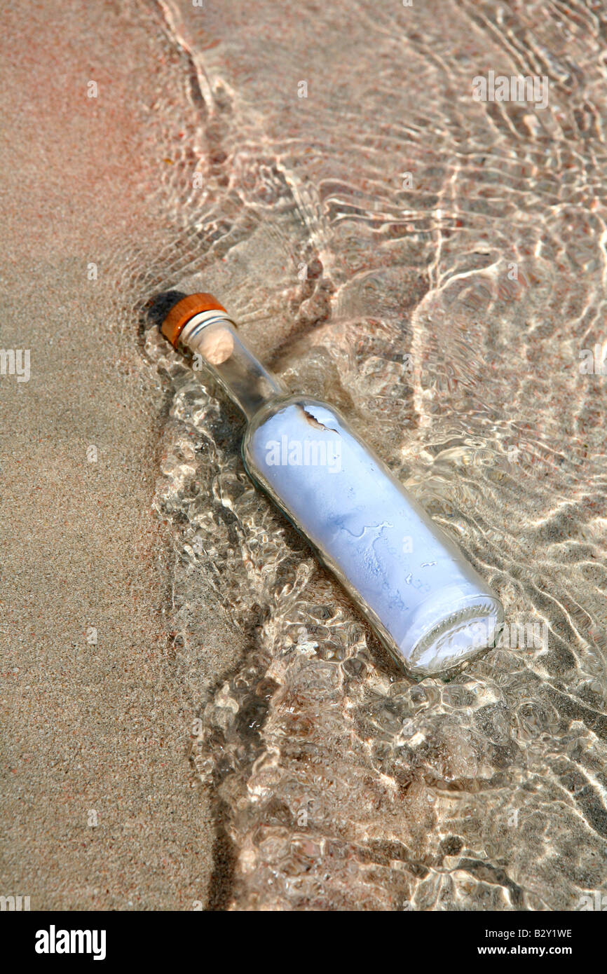 message in bottle lying on beach Stock Photo - Alamy