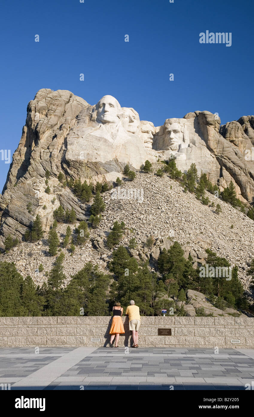 A man and woman at the Grand Terrace view of Mount Rushmore National ...