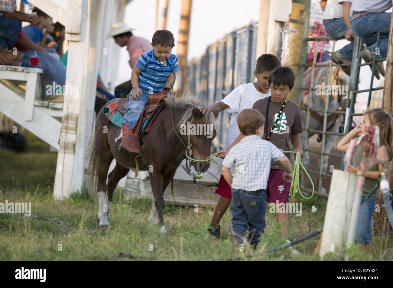 Little cowboys riding pony at PRCA Rodeo at Lower Brule, Lyman County ...