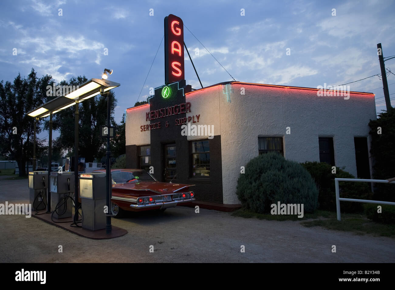 Neon sign reading "Gas" and 1960 red Impala Chevrolet at Kensinger ...
