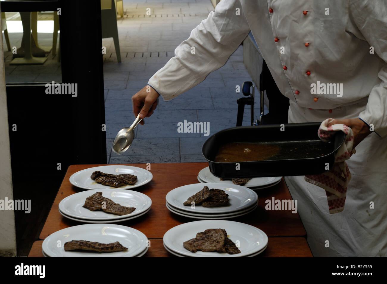 chef preparing for serving grilled filled from bovine meat Stock Photo ...