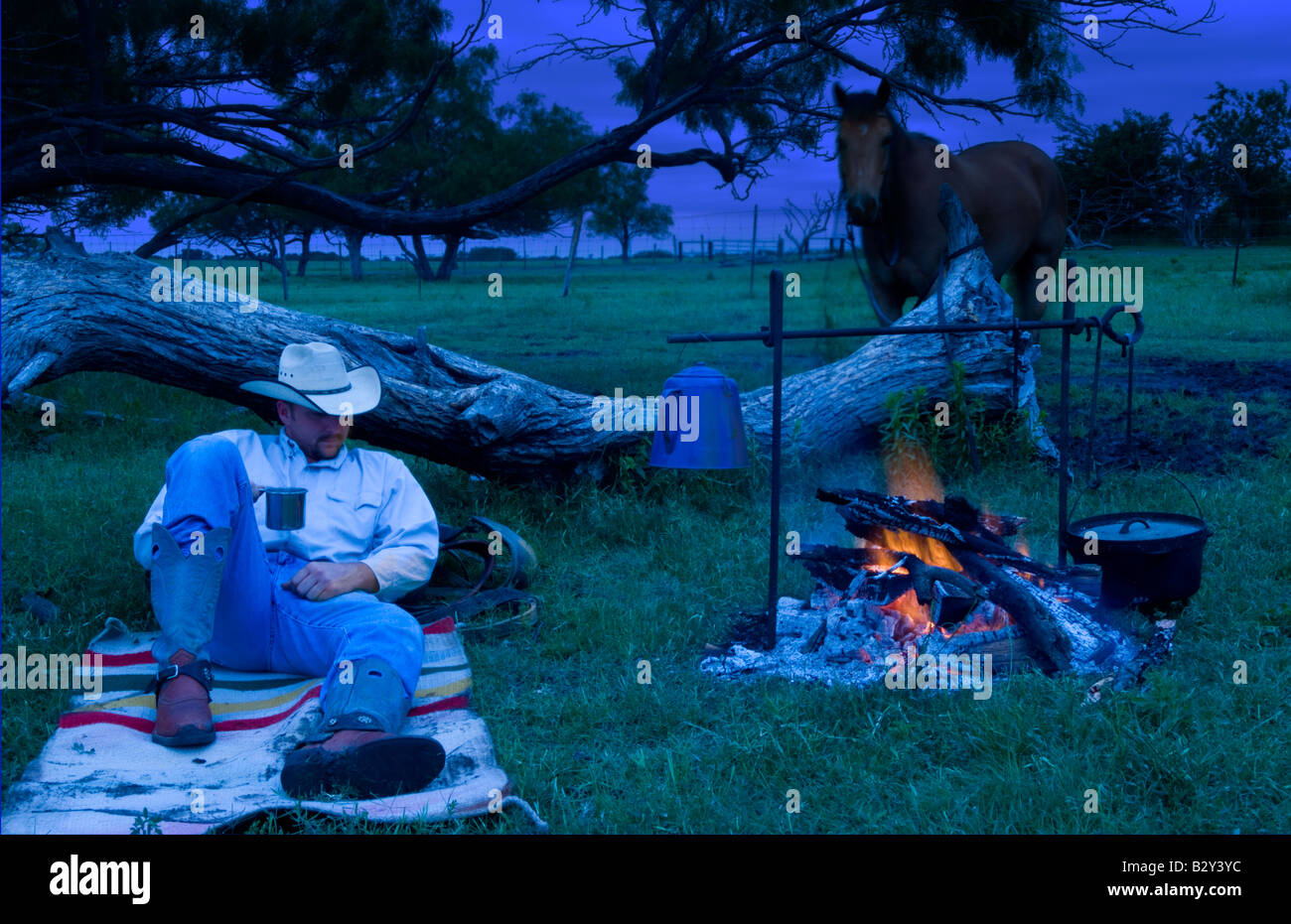 The life of a cowboy in the West USA with night campfire with horses ...