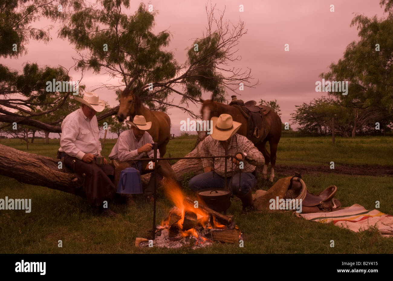 The life of a cowboy in the West USA with night campfire with horses ...