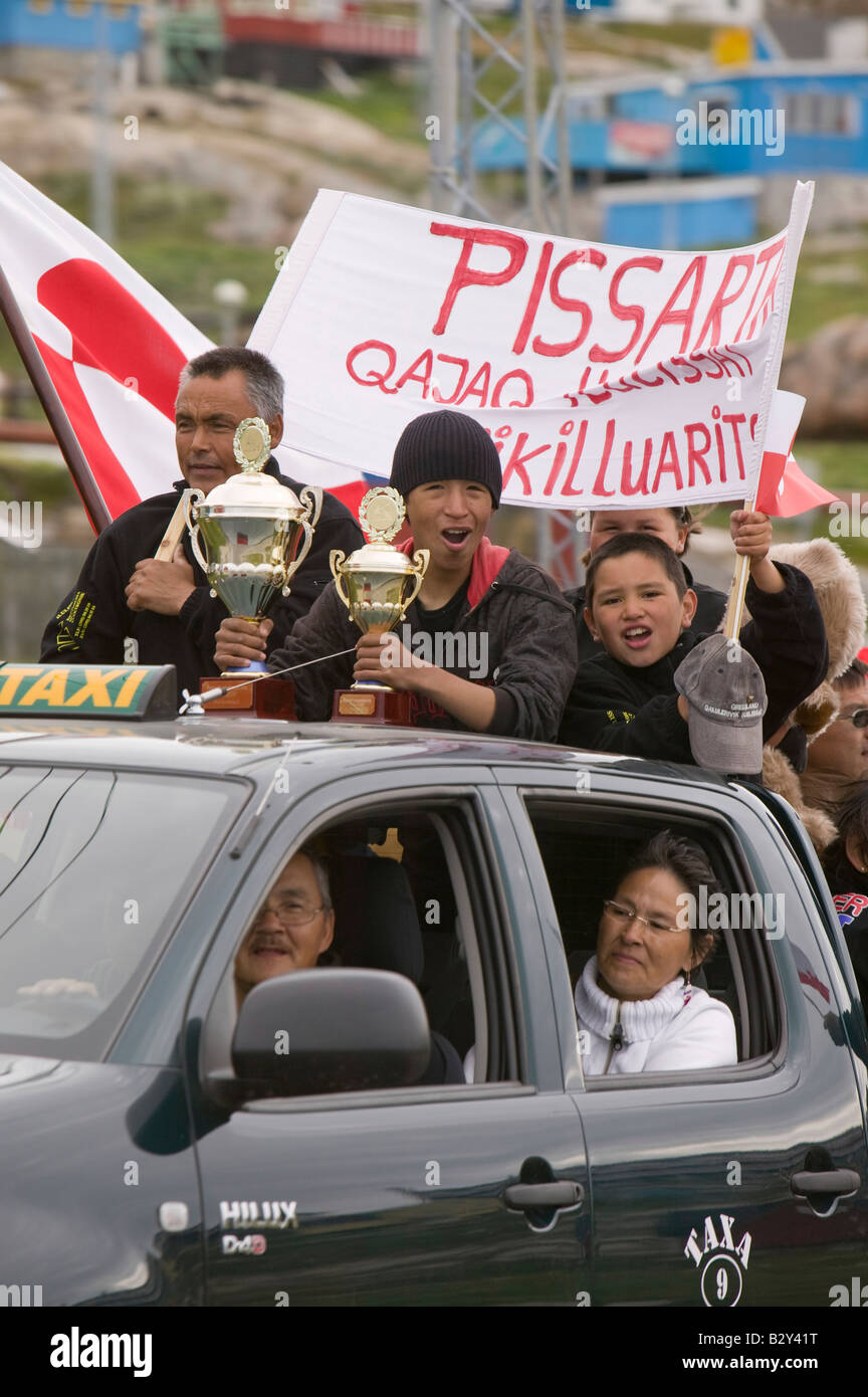 Inuits from Ilullisat celebrate their return from a football match by ...