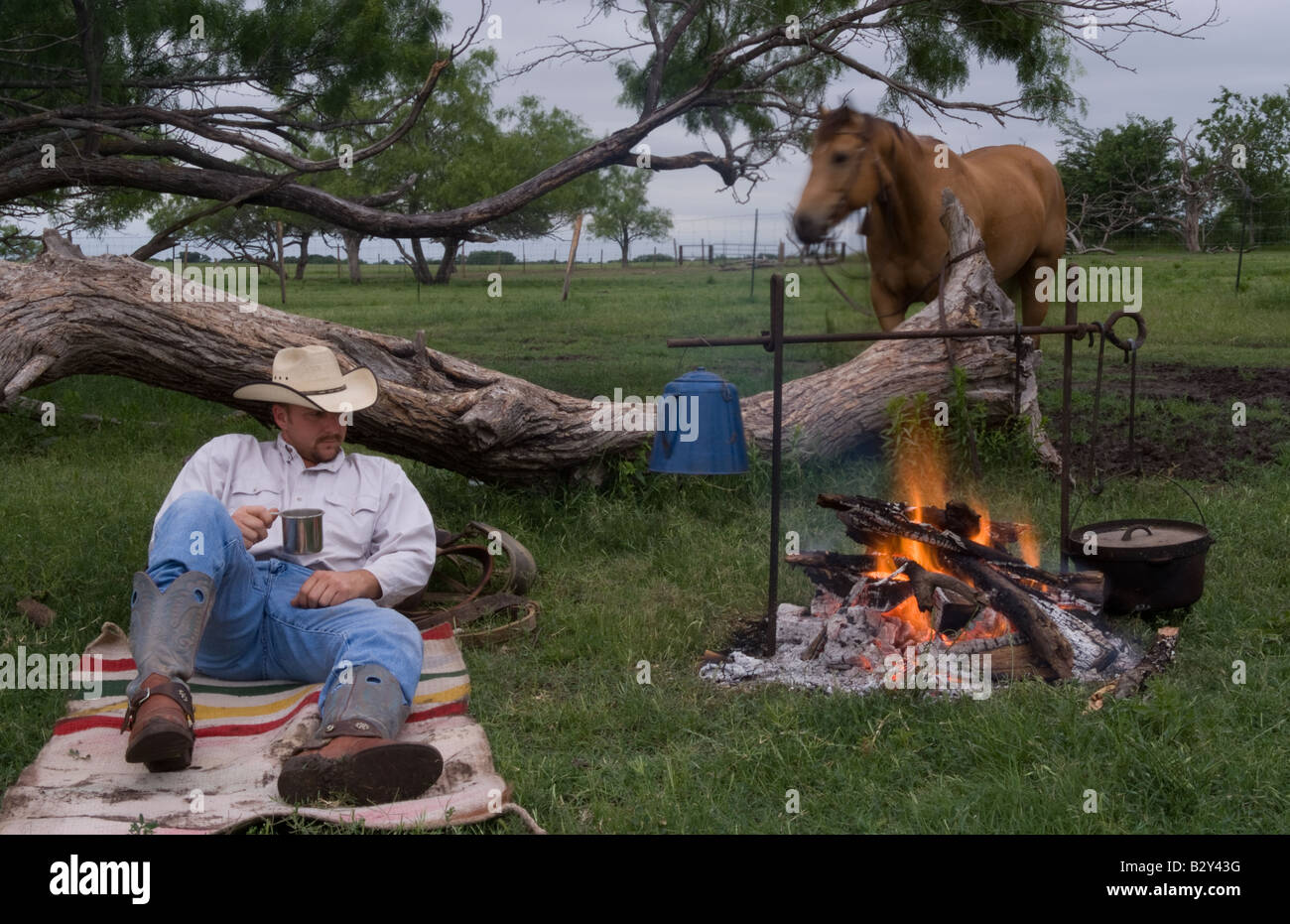 The life of a cowboy in the West USA with night campfire with horses ...