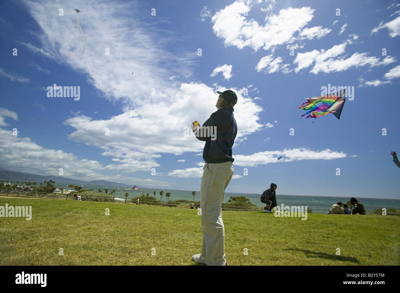 A man flying a kite in a deep blue sky on April 15, 2007, at the Santa ...