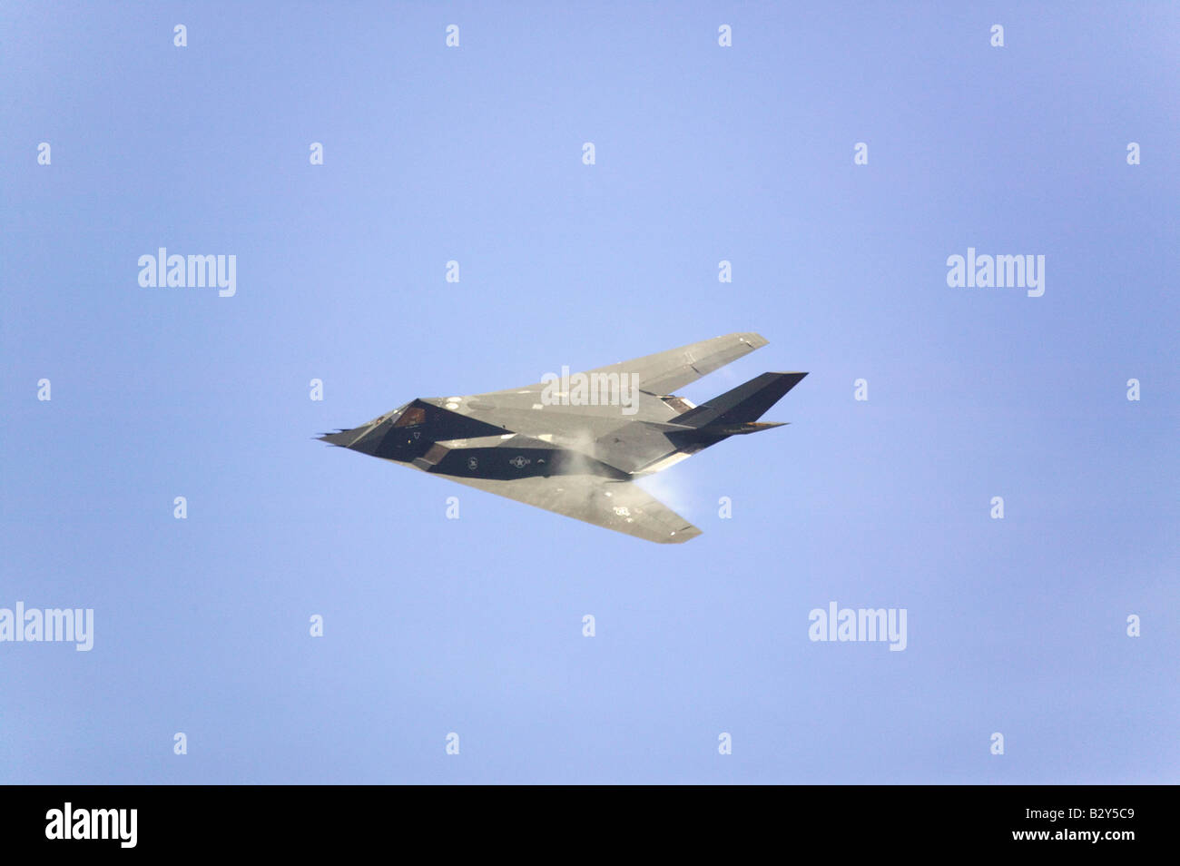 F-117A Nighthawk Stealth Jet Fighter flying over the 42nd Naval Base ...