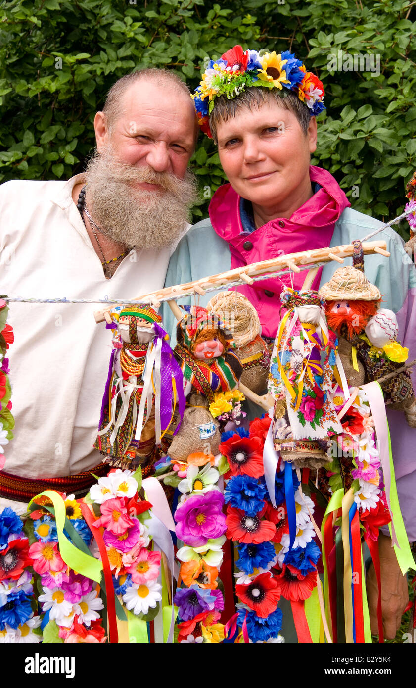 Man with beard and woman in traditional costume of Ukraine old clothes ...