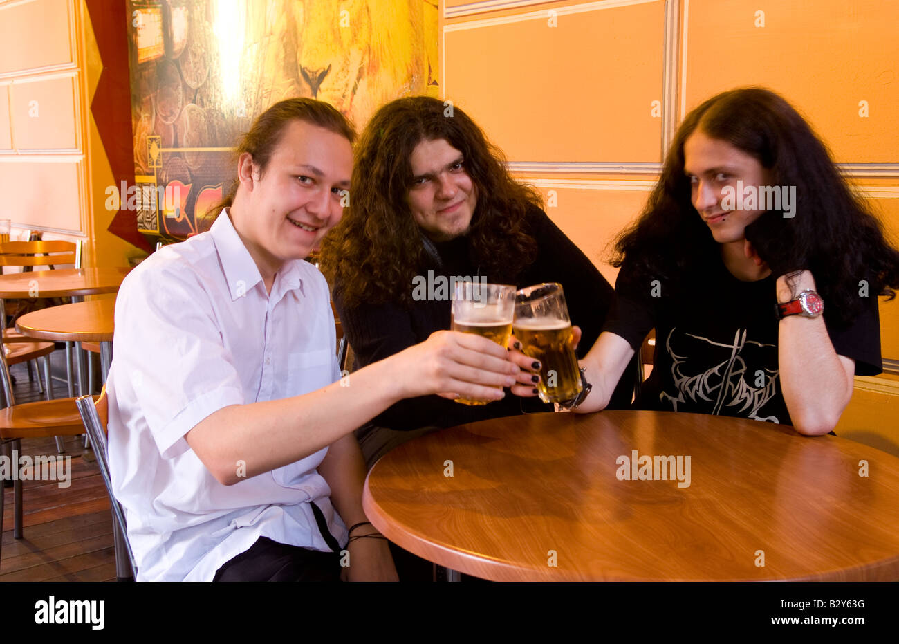 The Gothic life of teenagers having beer at restaurant in black dress ...