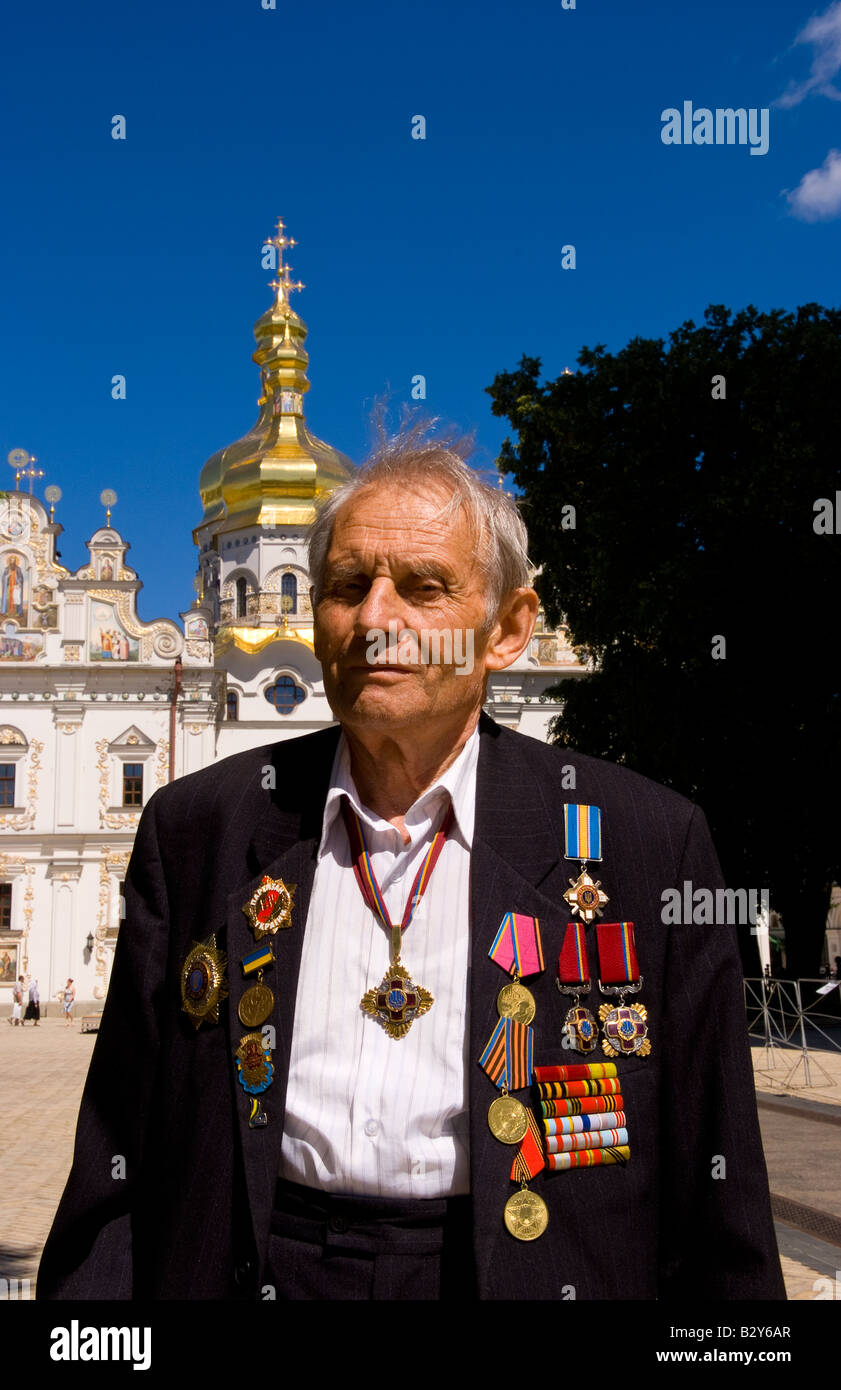 Old man soldier visiting the beautiful famous Perchersk Lavra Church ...