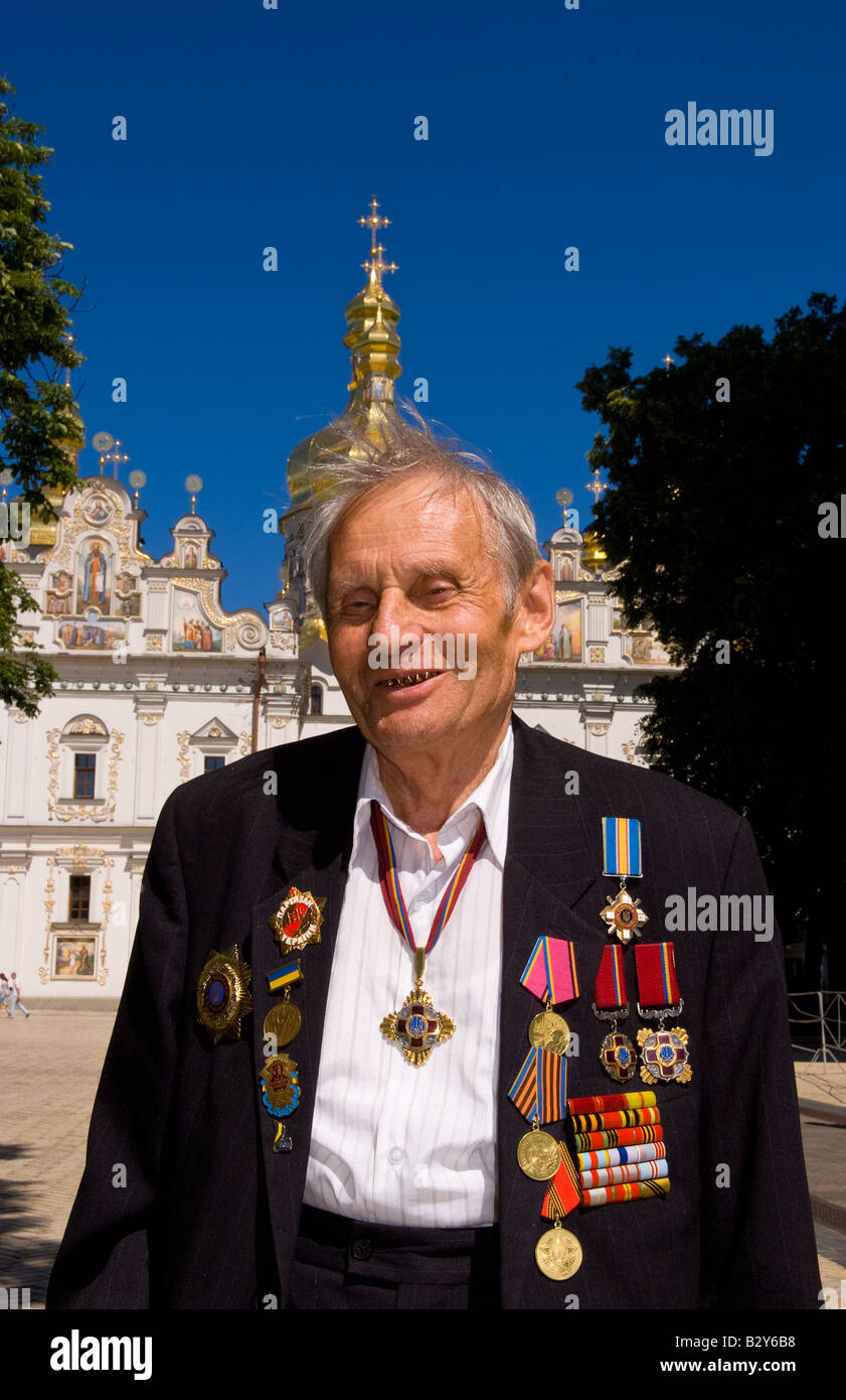 Old man soldier visiting the beautiful famous Perchersk Lavra Church ...