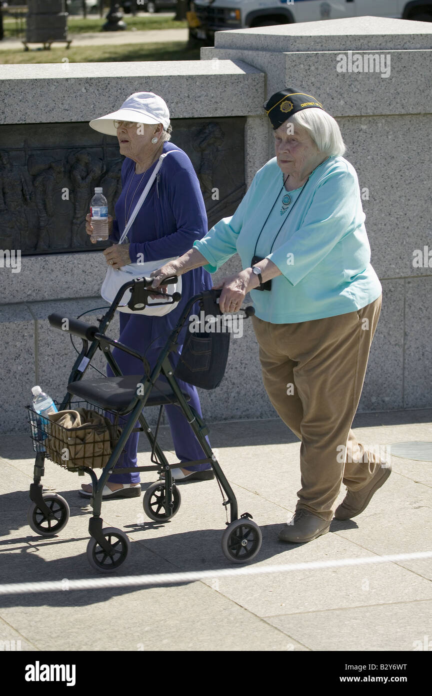 Senior woman veteran with cane departing National World War II Memorial ...