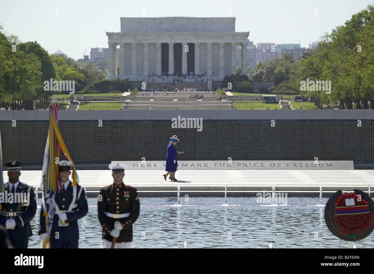 Queen Elizabeth II walking the National World War II Memorial with the ...