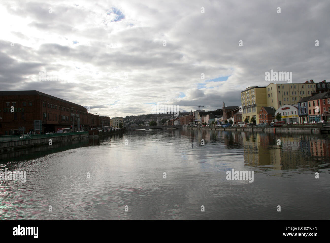 River with bridge and cloudy sky Stock Photo - Alamy