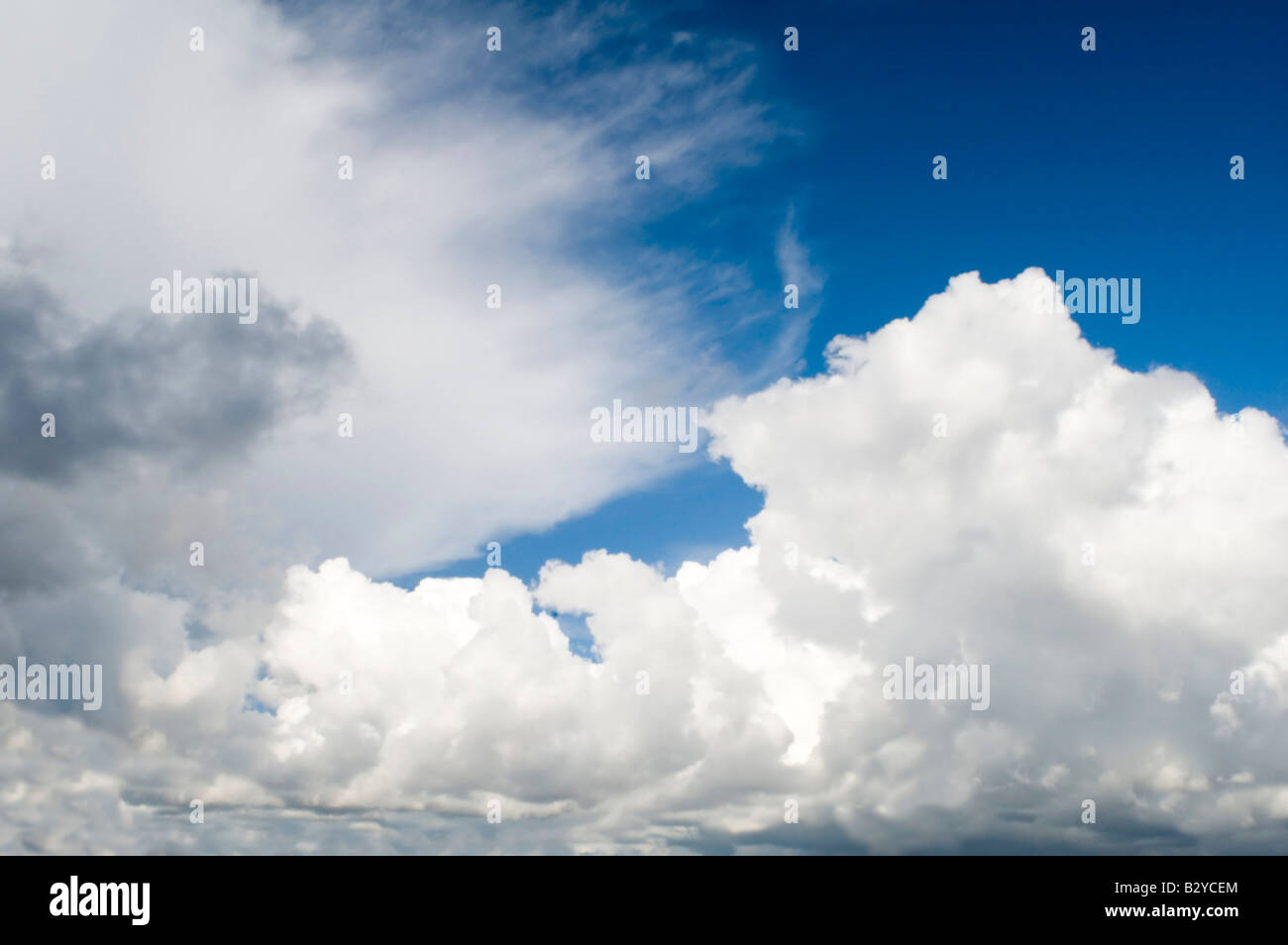 fleecy clouds grey clouds and blue sky Stock Photo - Alamy