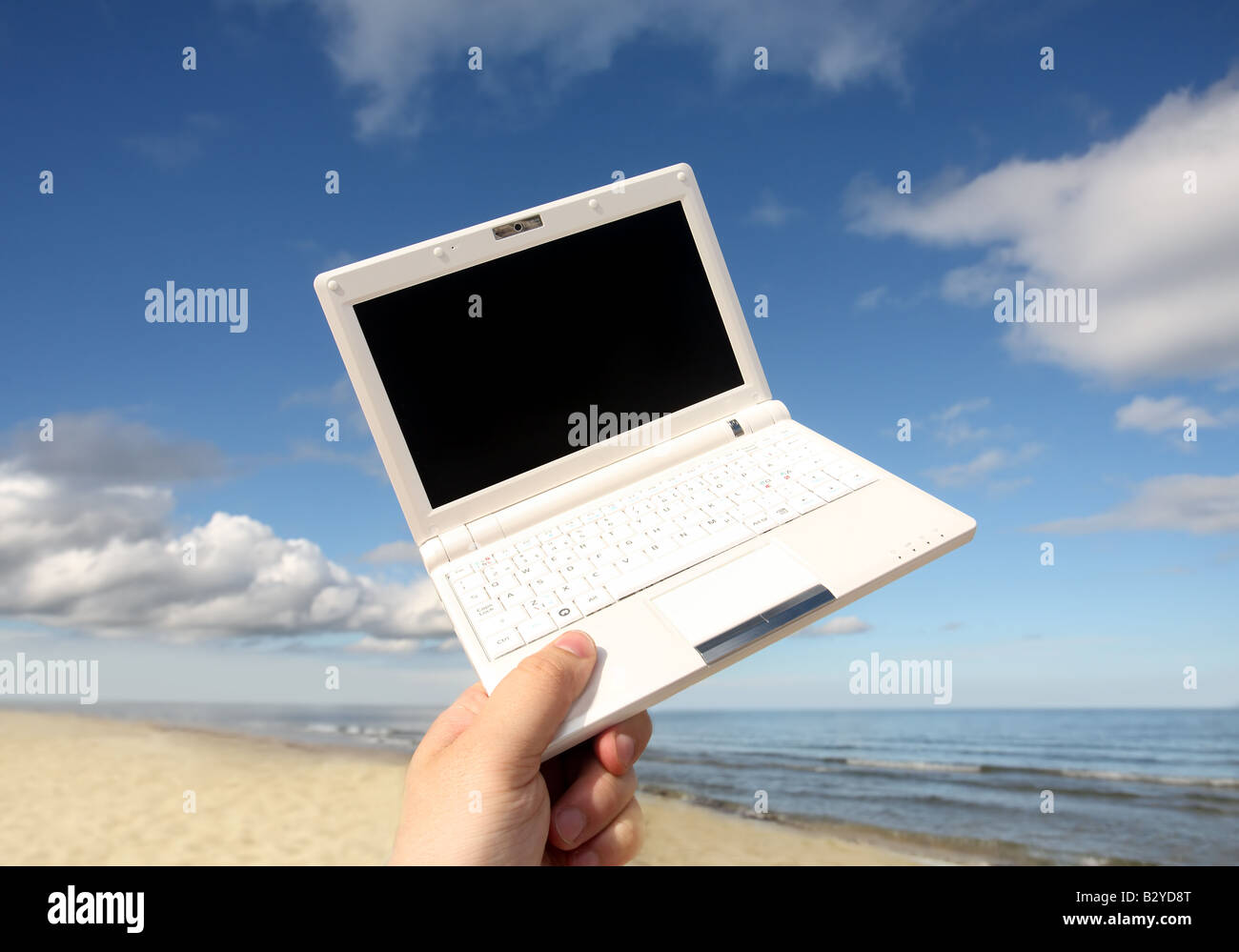 White small Laptop on the beach Stock Photo - Alamy