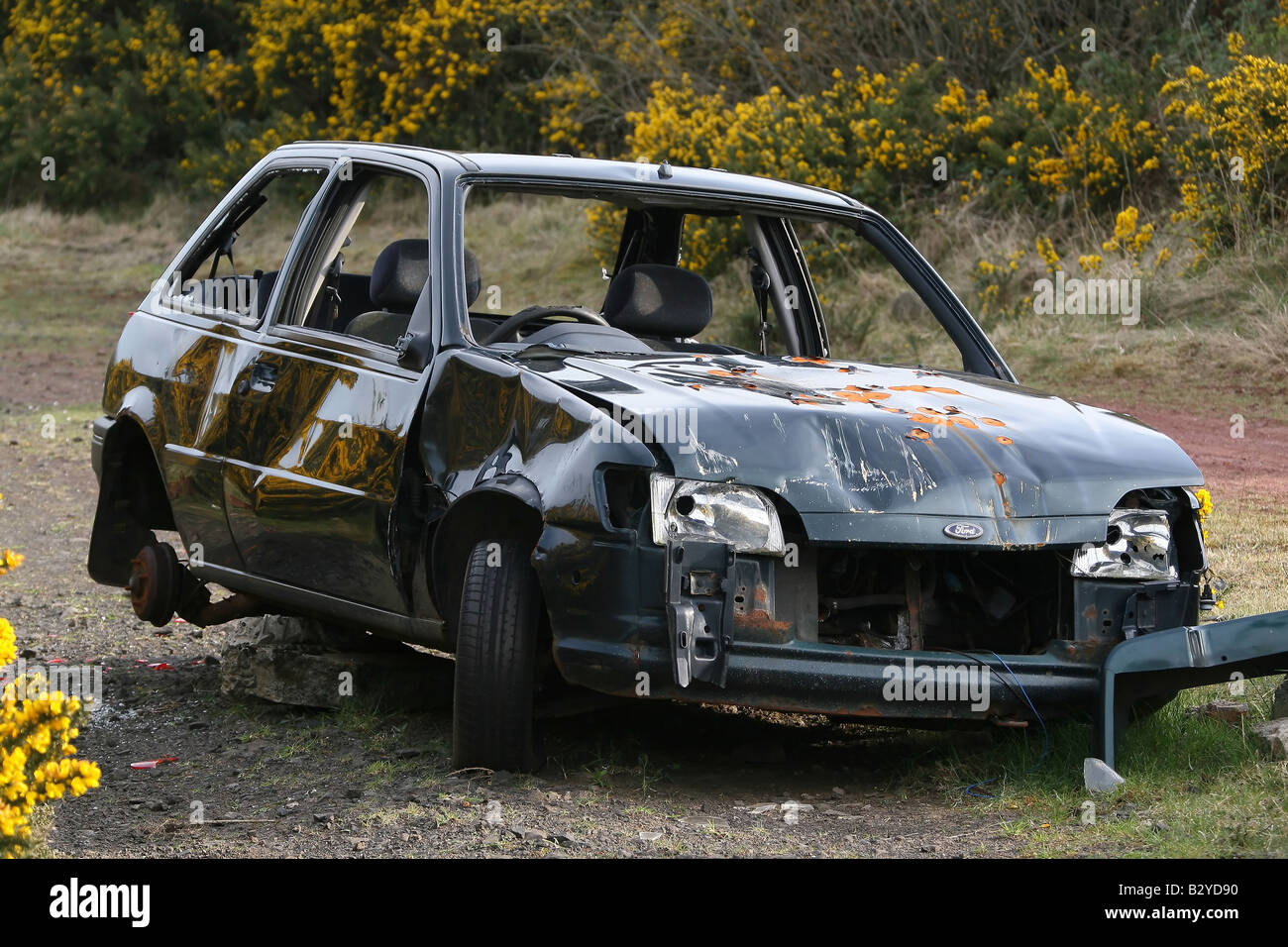 Scrap ford fiesta shot up with shot gun Stock Photo - Alamy