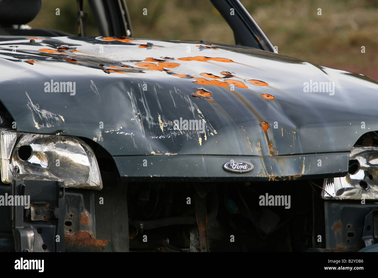 Scrap ford fiesta shot up with shot gun Stock Photo - Alamy