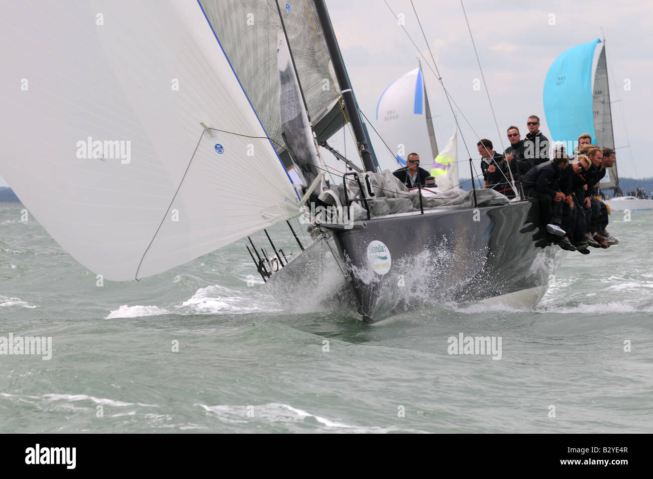 Bow of racing yacht TP52 design cutting through the waves sailing Cowes ...
