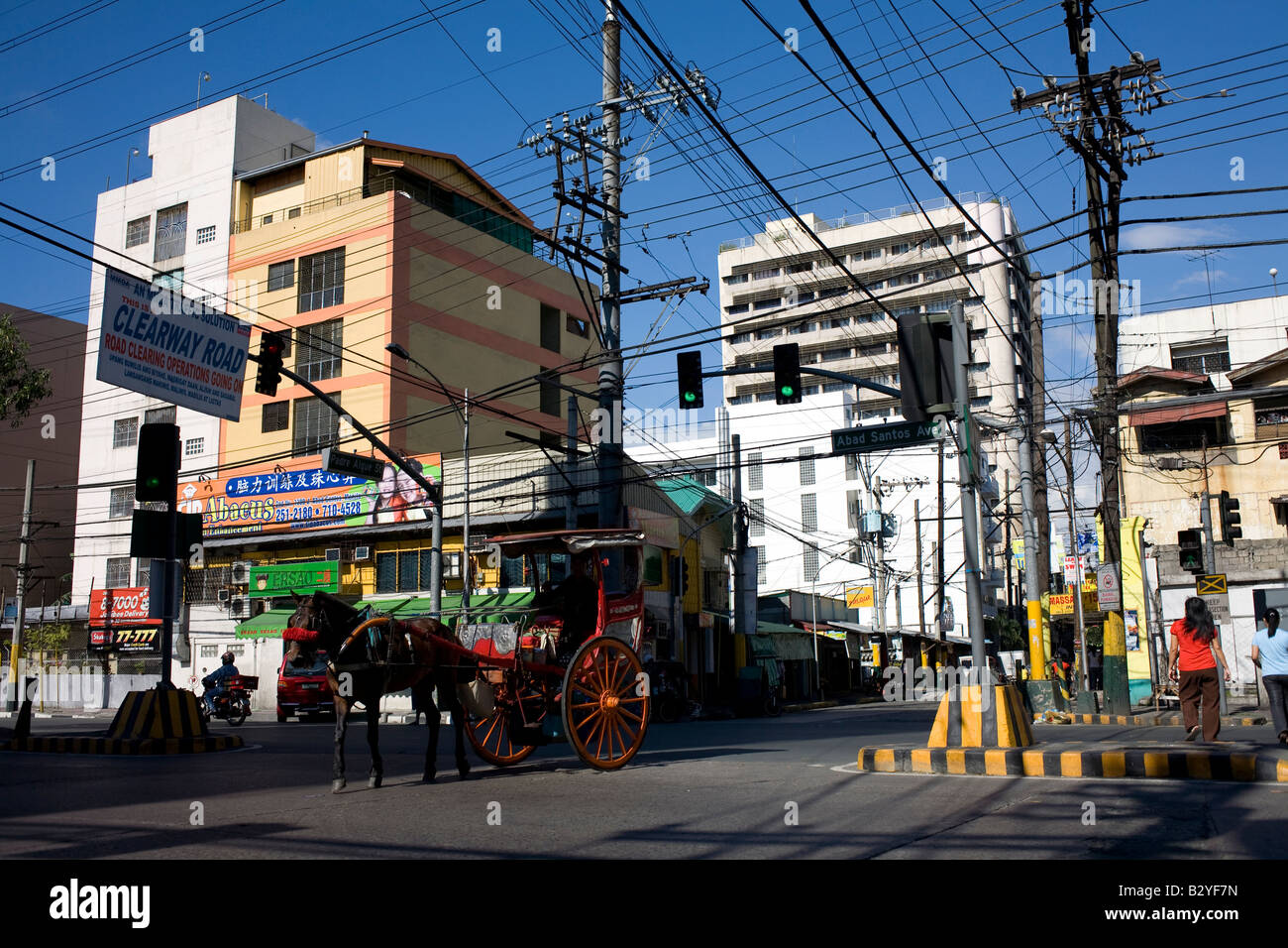 A kalesa crosses through an intersection in Manila, Philippines Stock ...