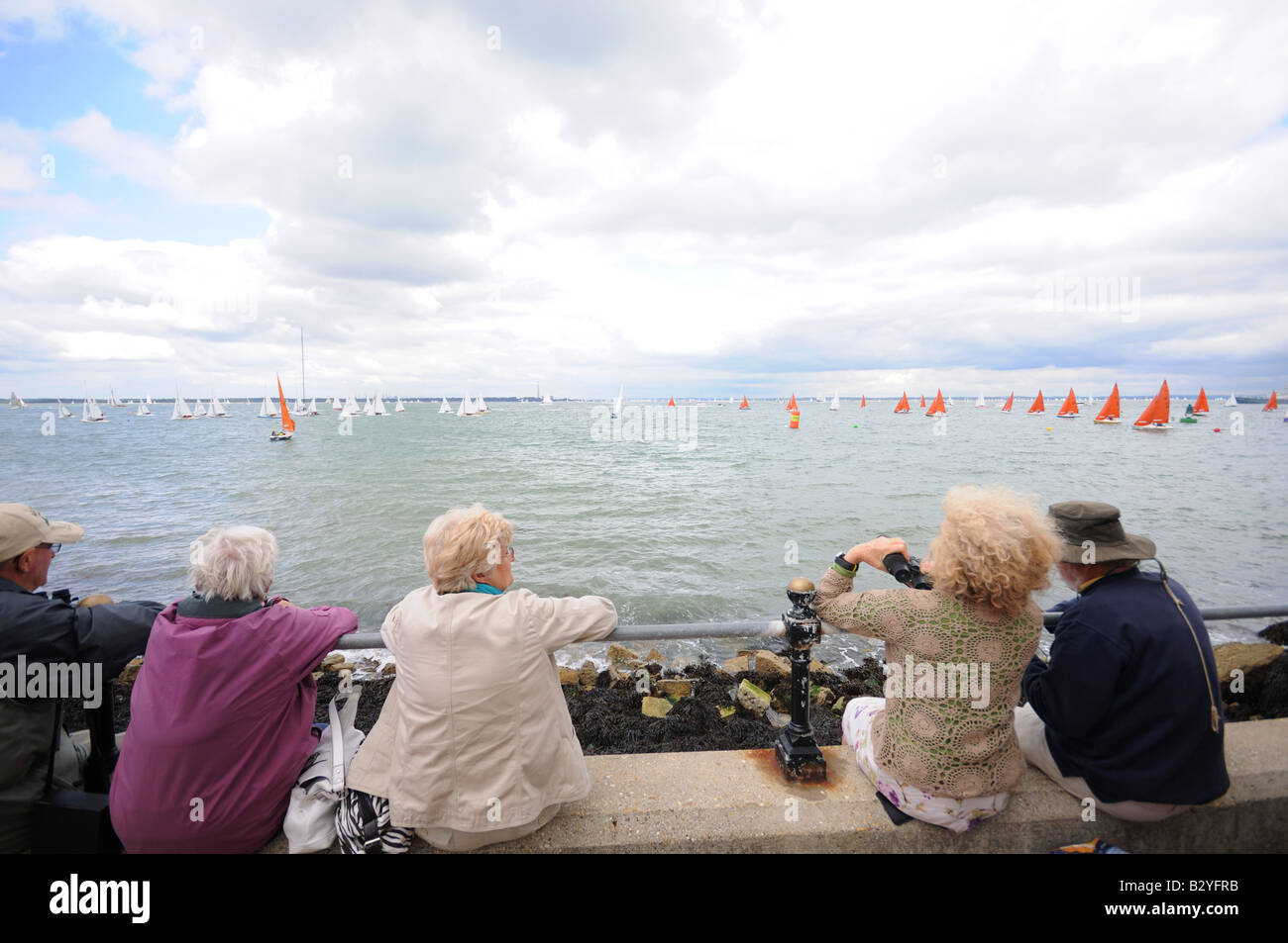 spectators watching the start of the races at the squadron startline ...