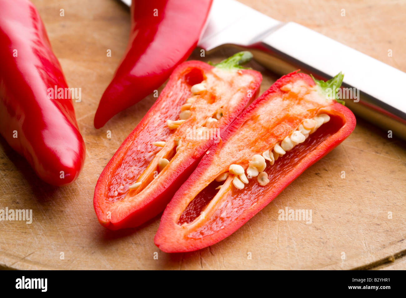 halved sliced red chile peppers with seeds Stock Photo - Alamy