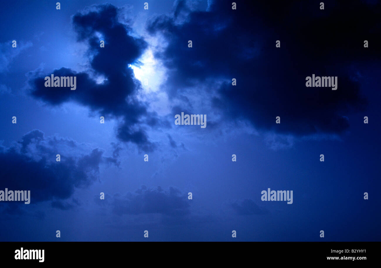 Blue Stormy Sky With Sun Stock Photo - Alamy
