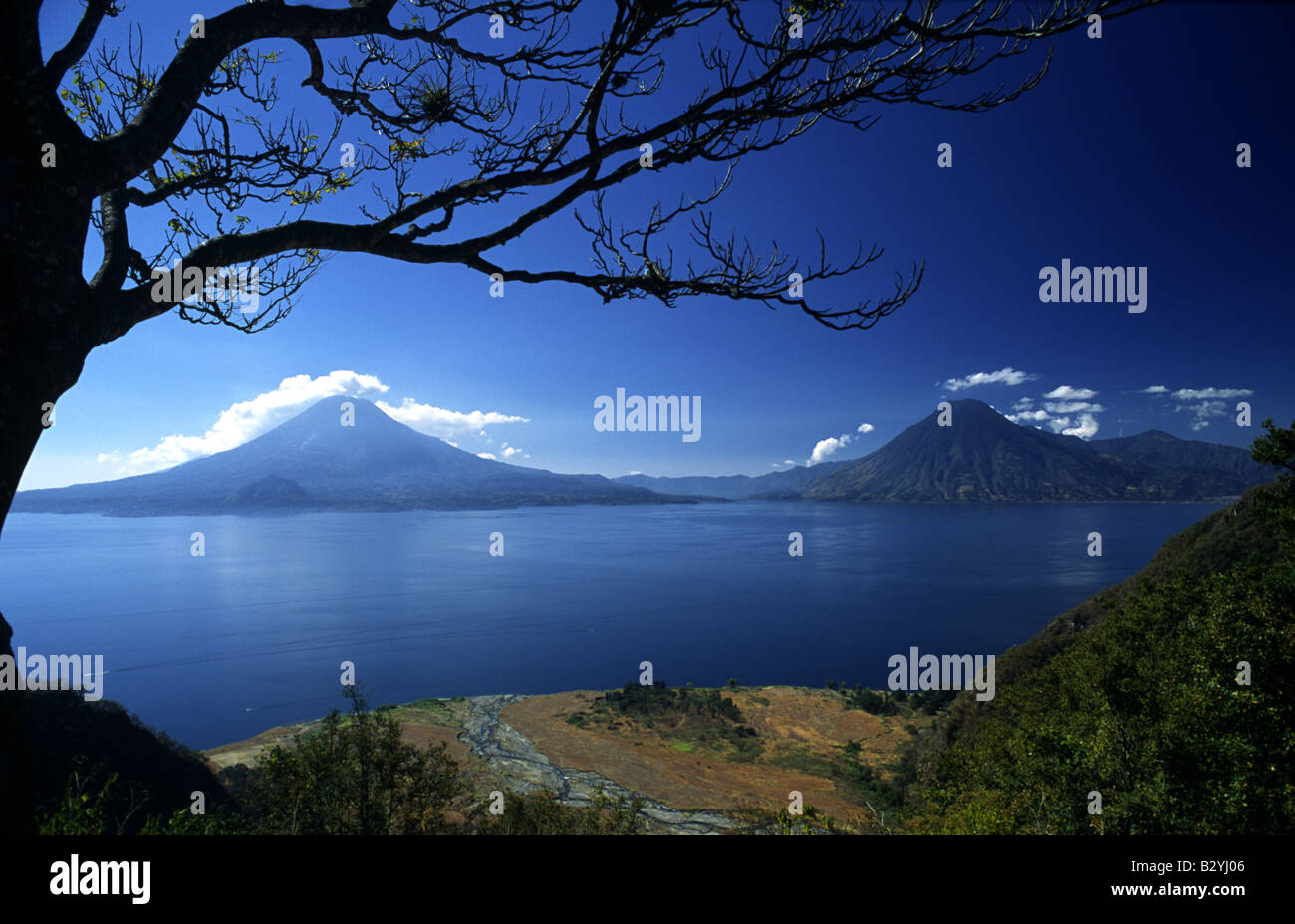 Lake Atitlan in the early morning with Toliman Volcano and San Pedro ...