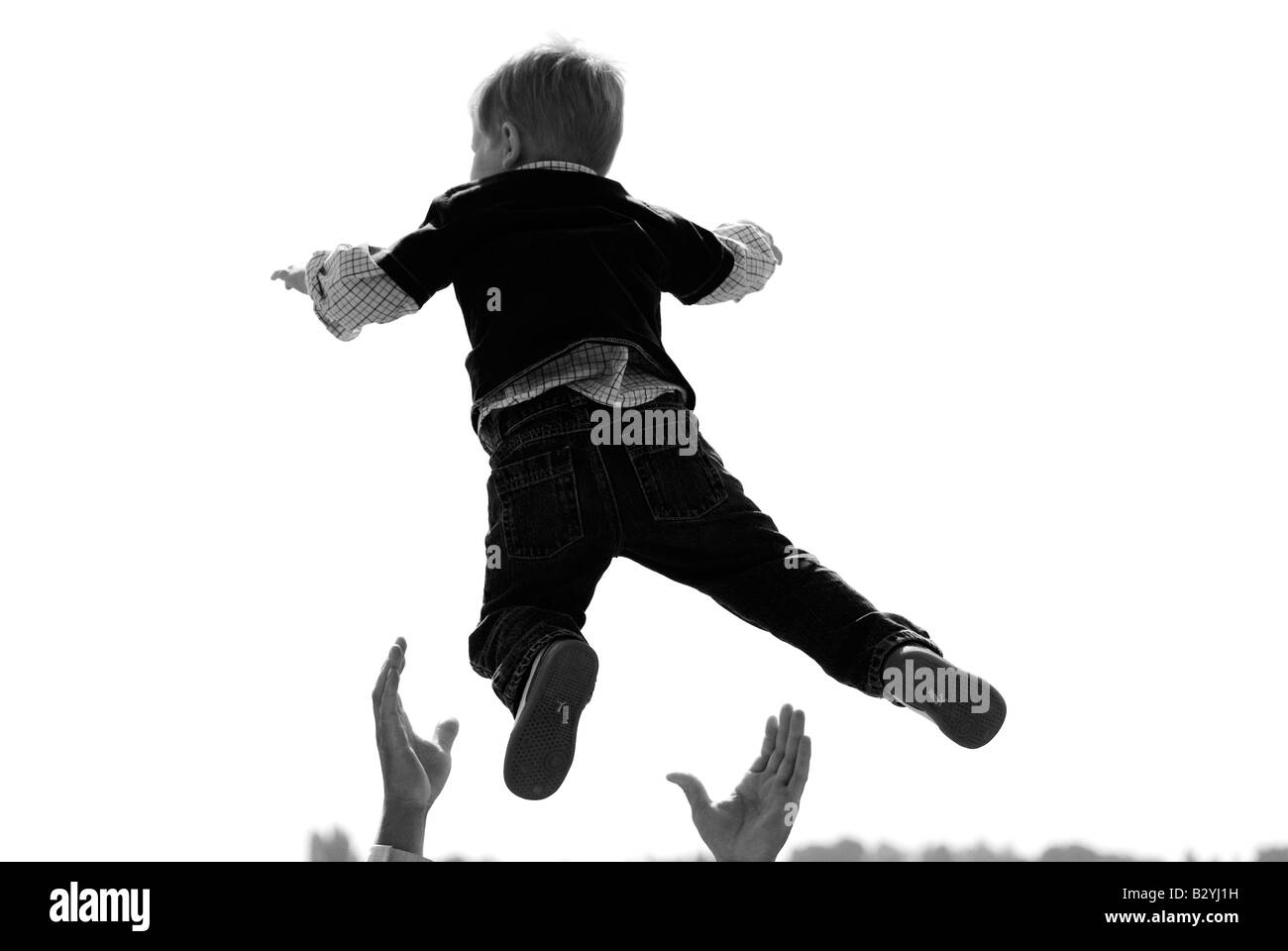 Father's hands catching his son Stock Photo - Alamy