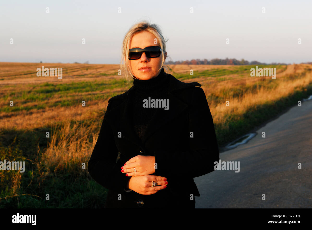 Posh black coat hi-res stock photography and images - Alamy