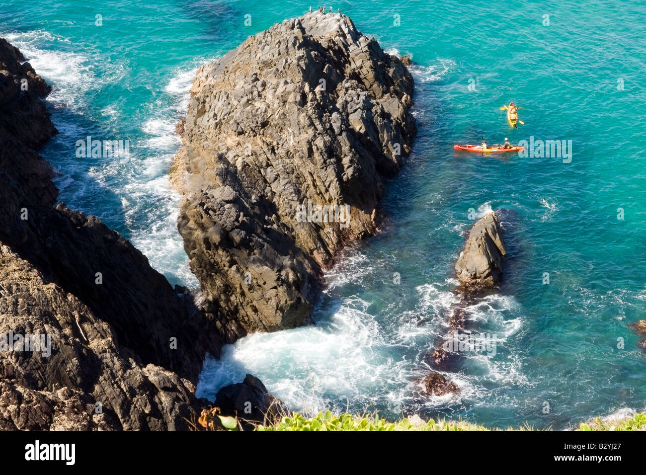 Canoeists inspecting 'Hell's Gates', Noosa National Park, Queensland ...