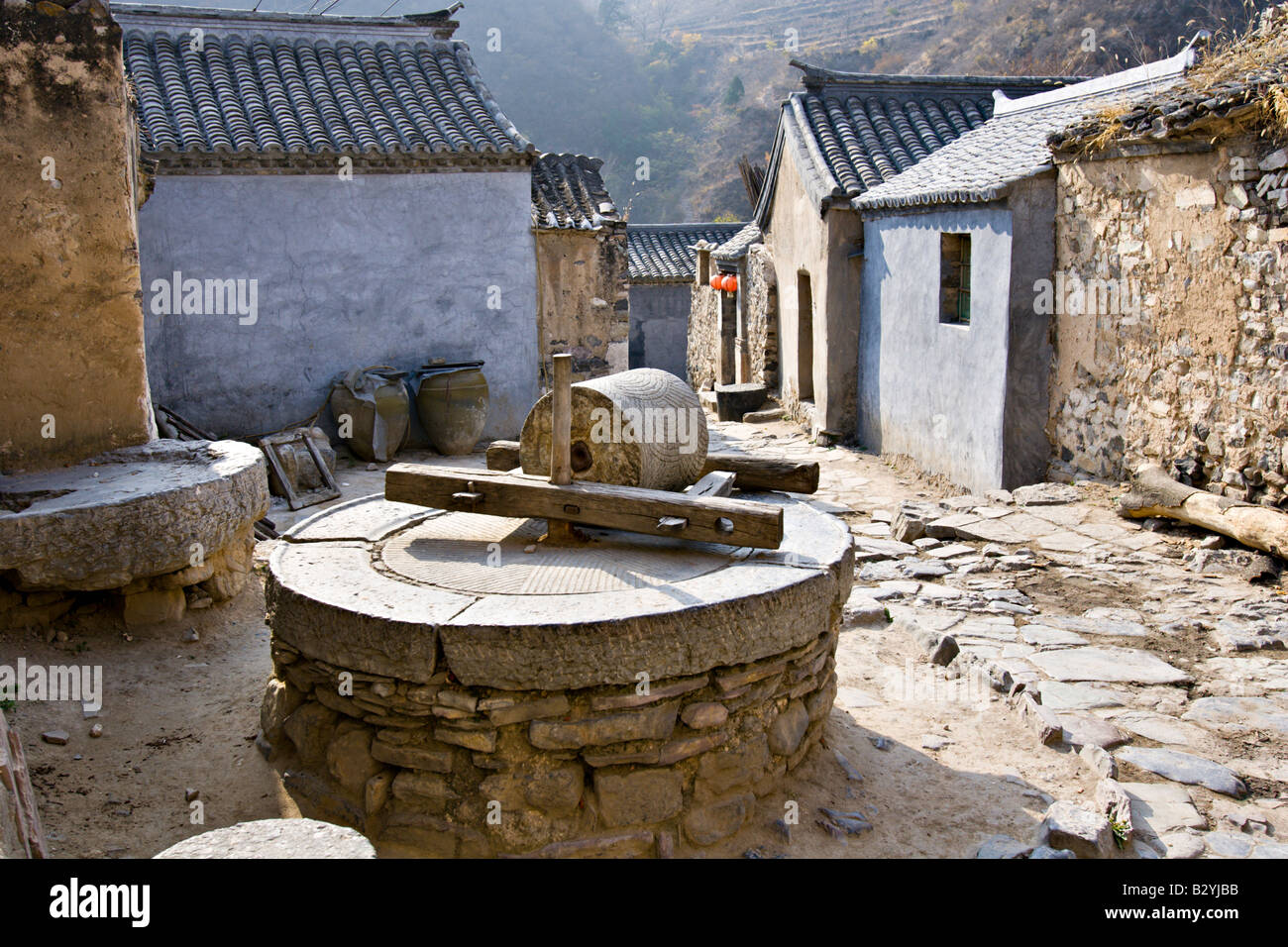 CHINA Chuandixia Ancient stone grindstone and cheerful red lanterns in ...