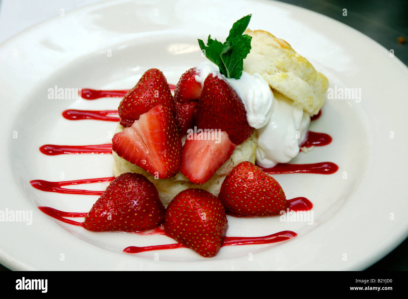gourmet Strawberry dessert on white plate Stock Photo - Alamy