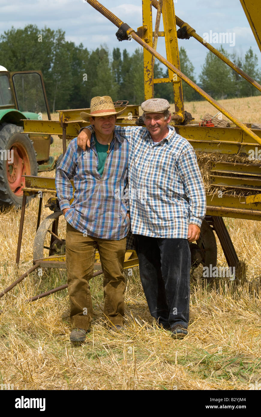 Two French farmers embracing at agricultural show, Indre, France Stock ...