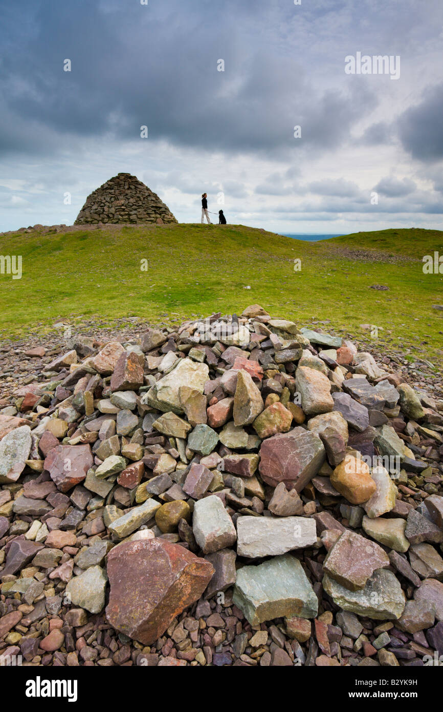 Stone cairns and dogwalker at Dunkery Beacon in Exmoor National Park ...