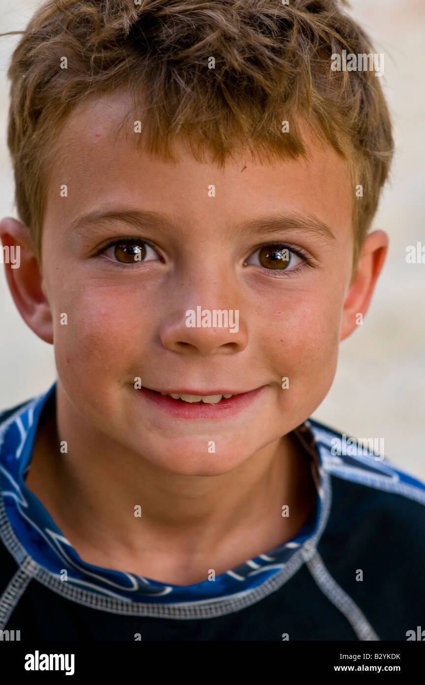 Idaho, Middle Fork of the Salmon River. A happy young rafter smiles for ...