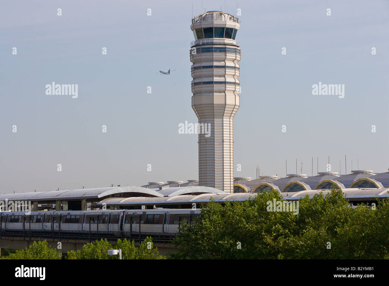 Airtraffic Control tower as a plane flies by at Ronald Reagan ...