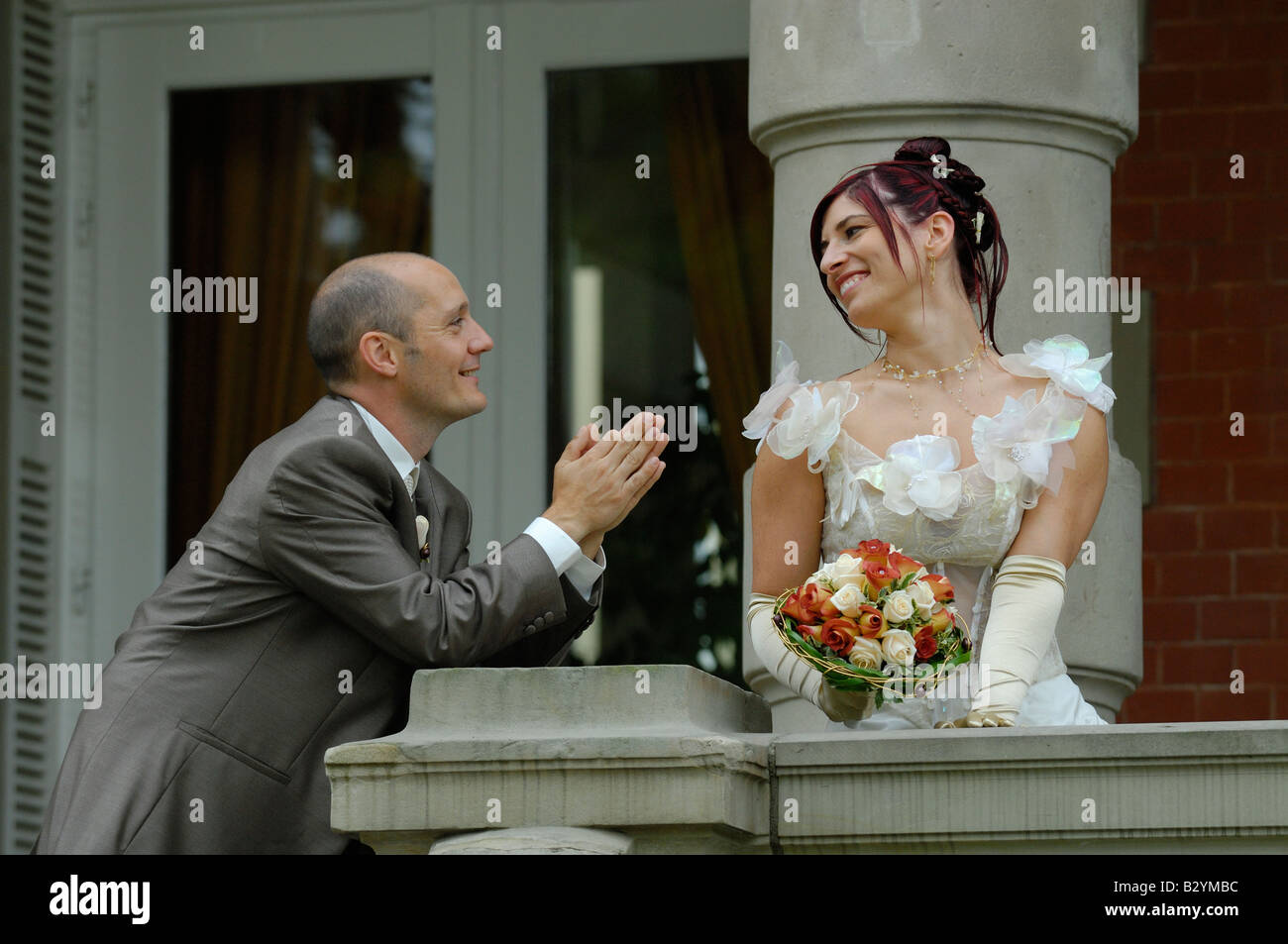 Bridegroom imploring his bride, France Stock Photo - Alamy