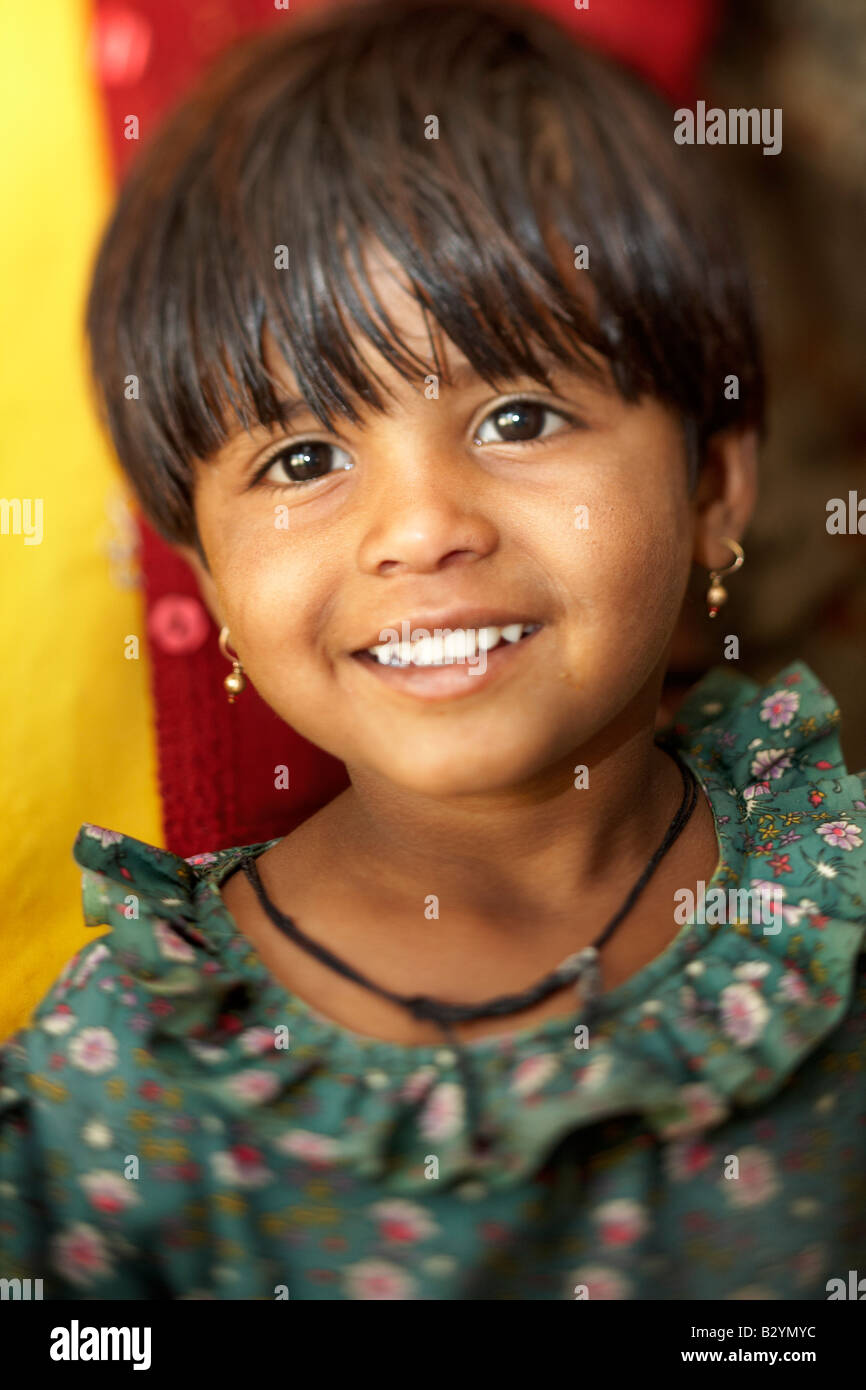 A young smiling Indian girl in her rural home on the outskirts of ...