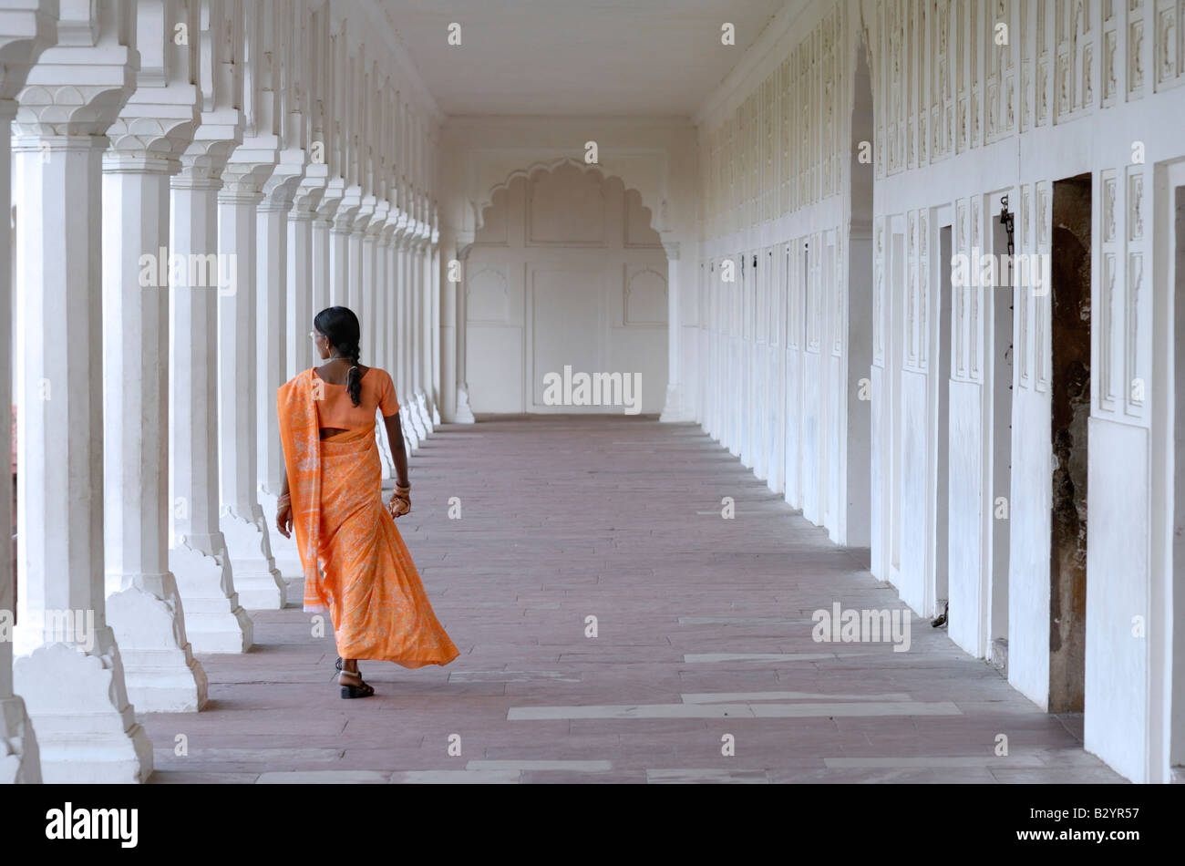An indian woman walking in the colonnade of Agra fort Stock Photo - Alamy