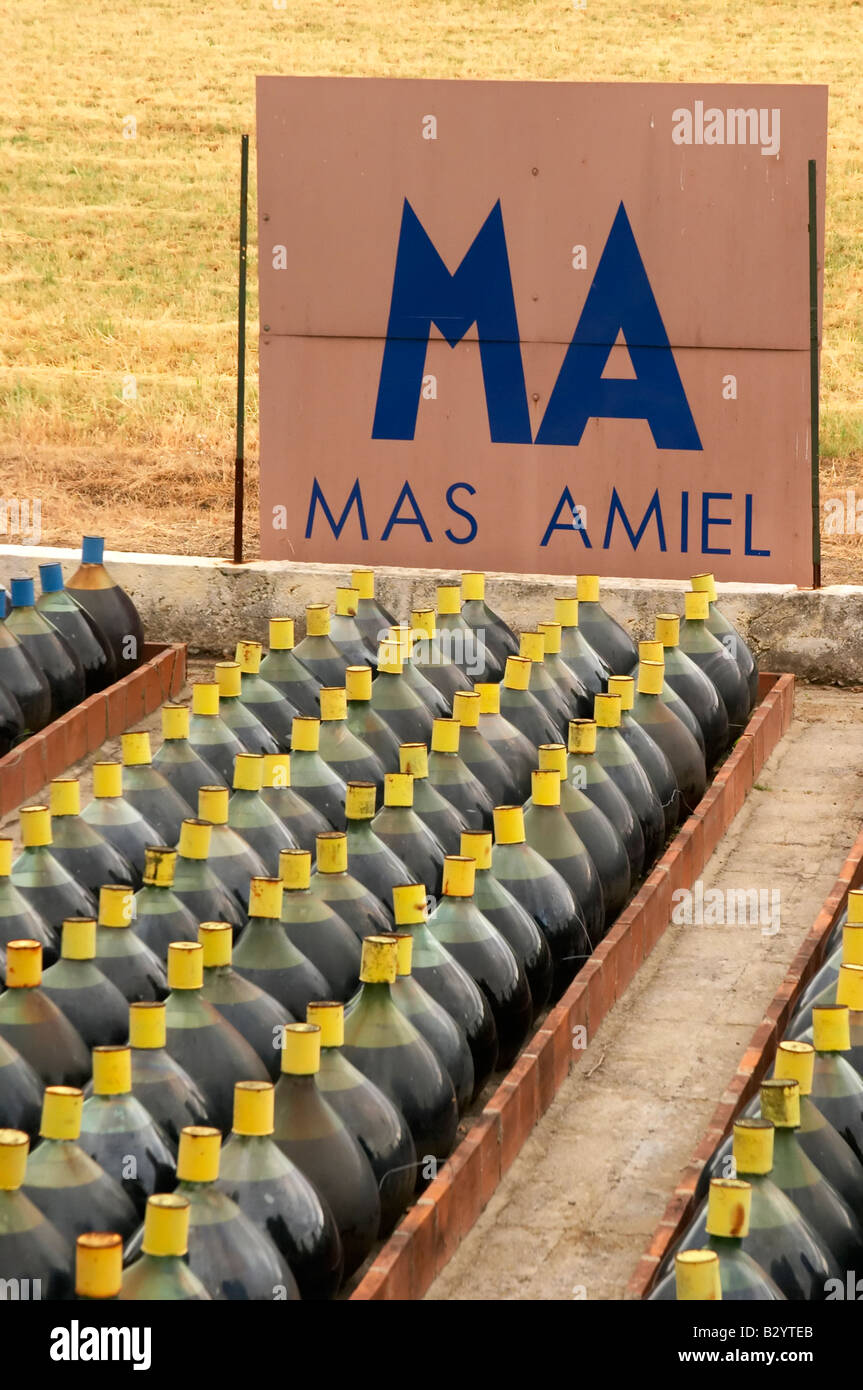 Demijohns with Rivesaltes and maury wine stored outside for aging. Mas ...